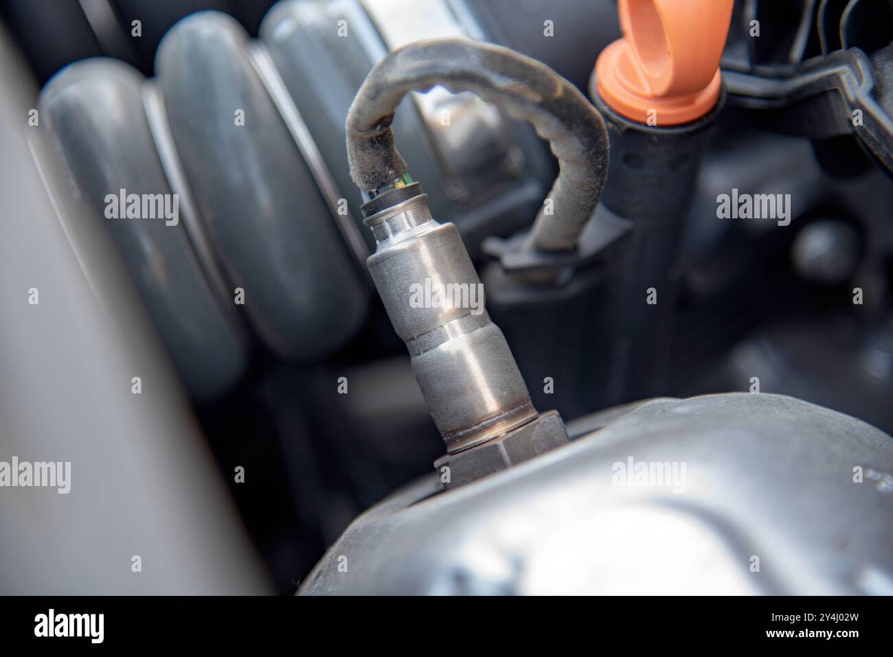 Cars oxygen sensor on an exhaust manifold Stock Photo - Alamy