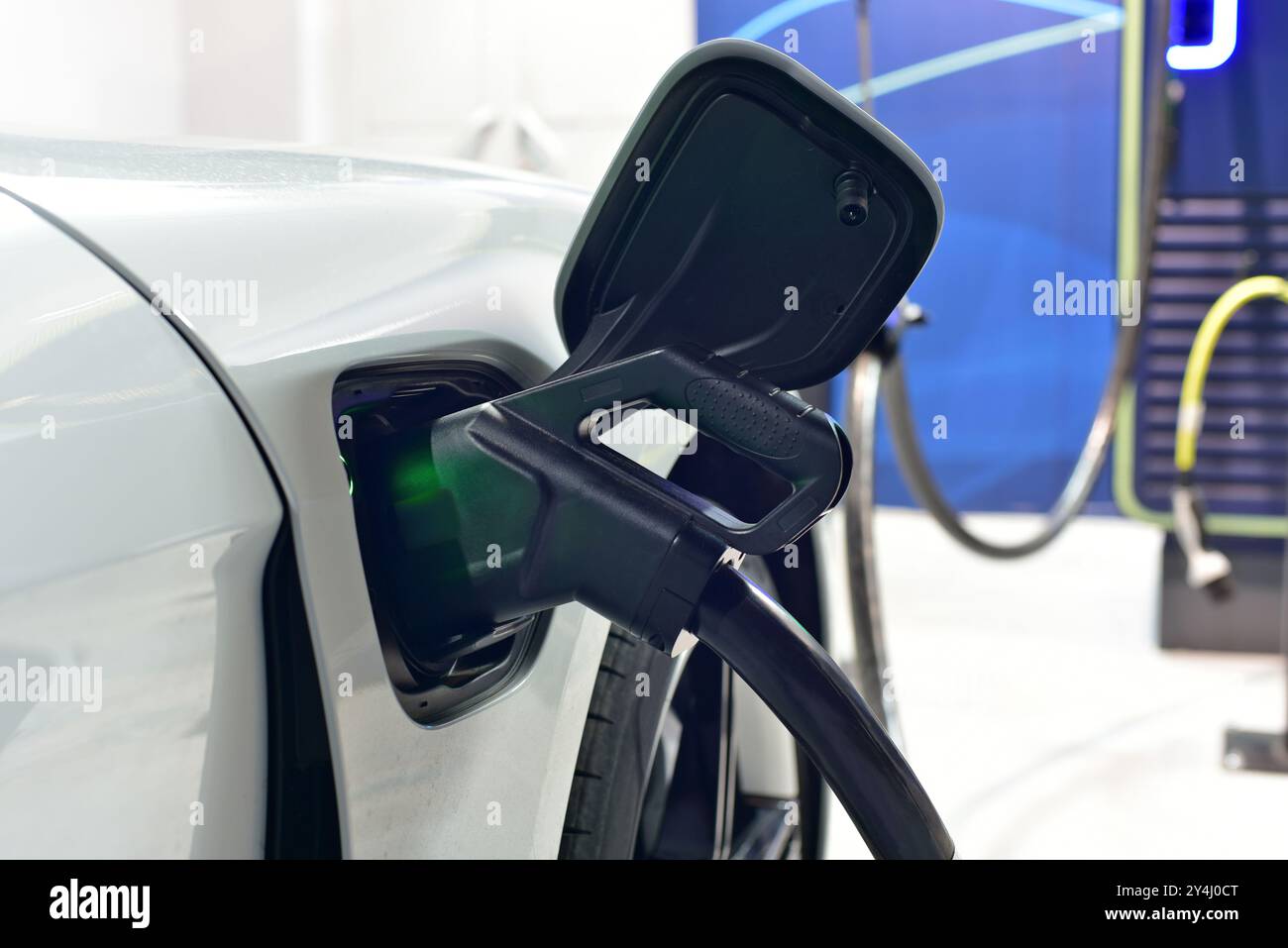Connected charging connector to electric car. Loading energy of an ...