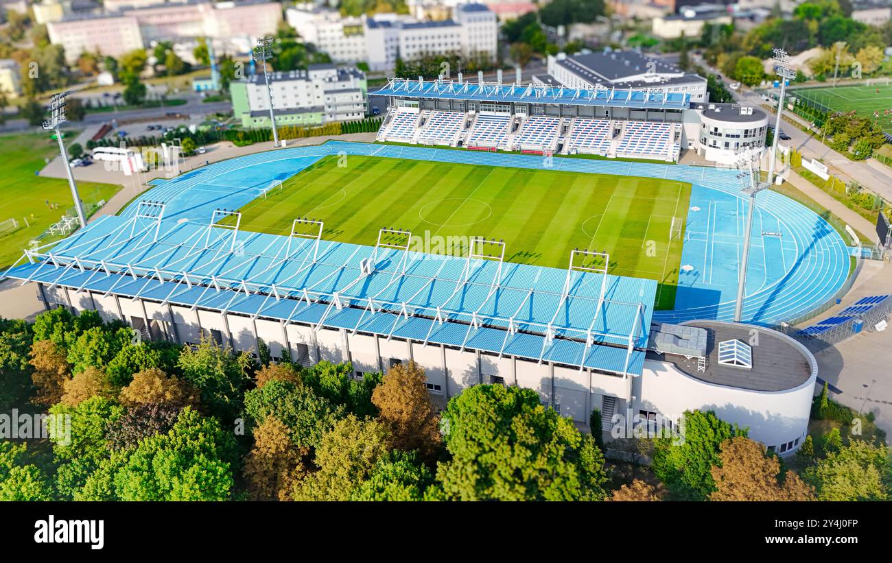 A high quality aerial view of a modern sports stadium, featuring a ...