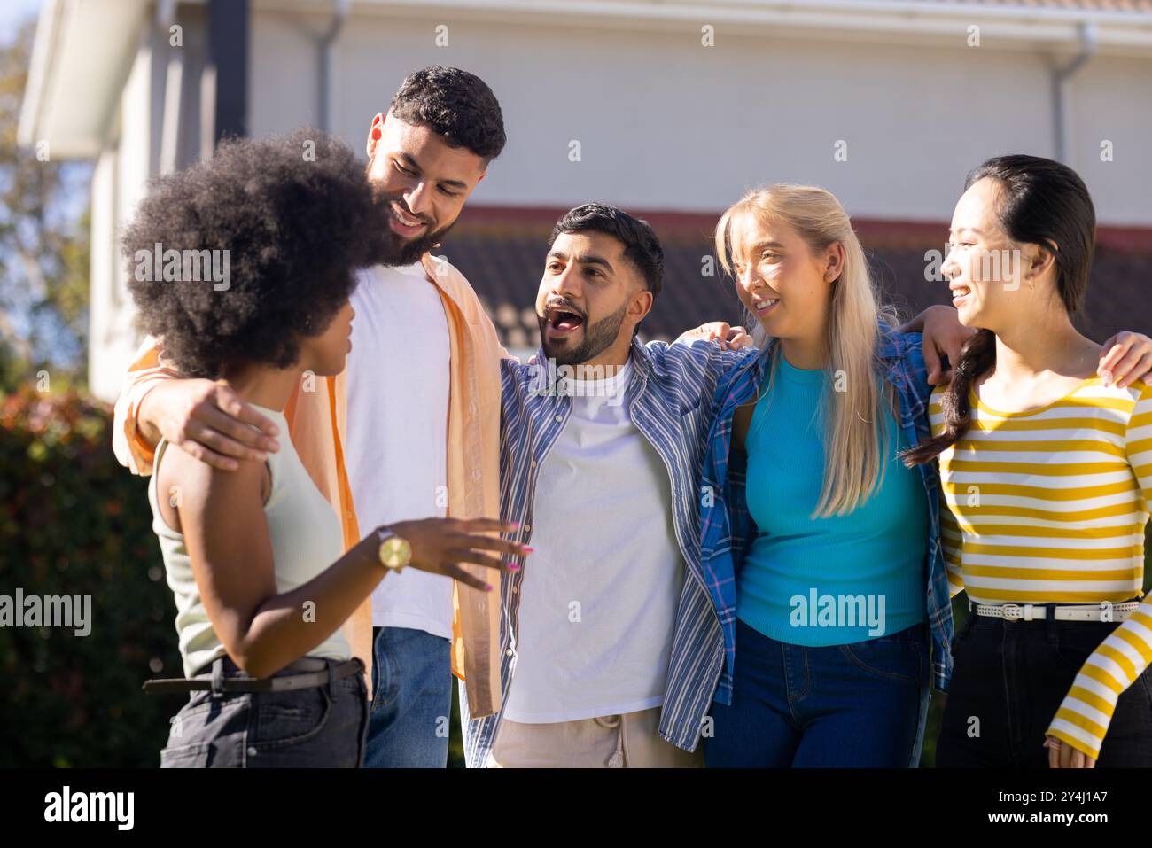 Group of friends talking outdoors hi-res stock photography and images ...