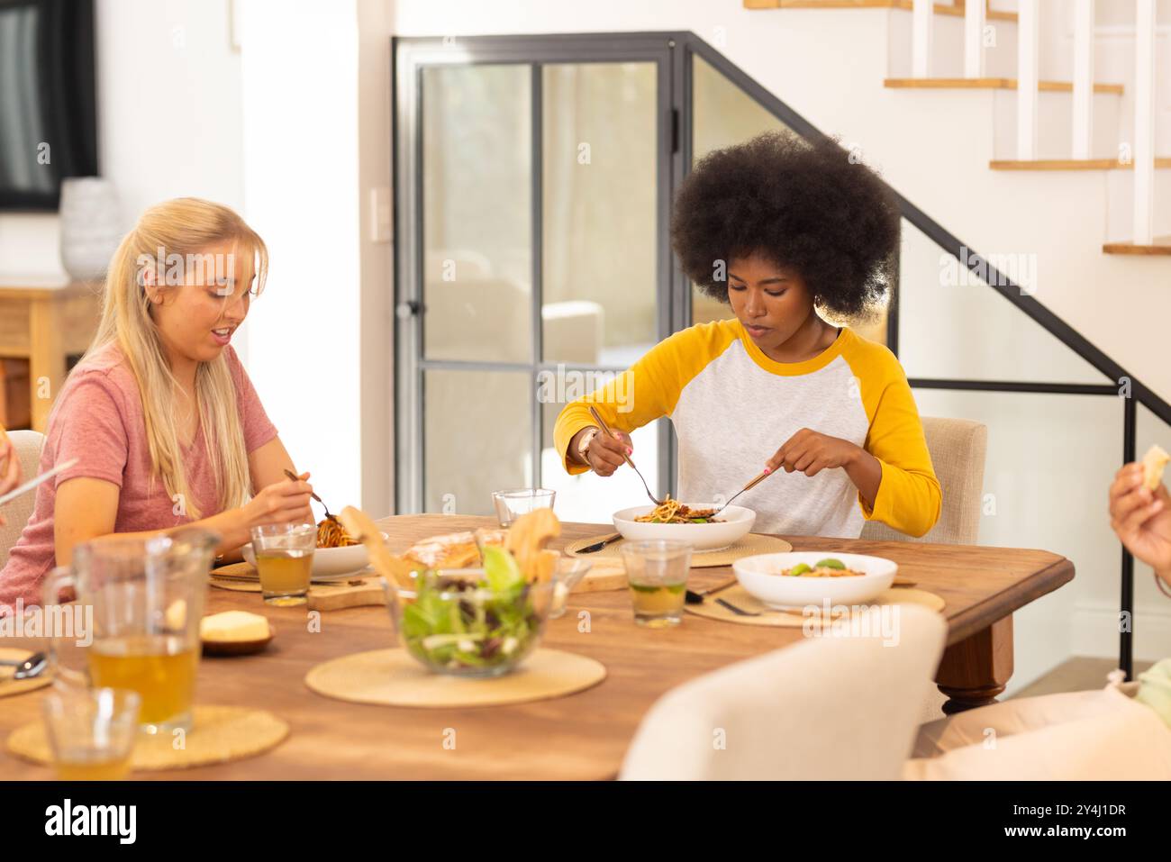 Chatting friends dining together hi-res stock photography and images ...