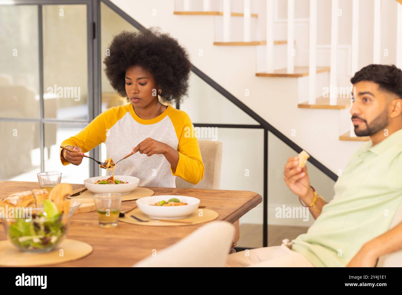 Diverse group of people eating dinner hi-res stock photography and ...