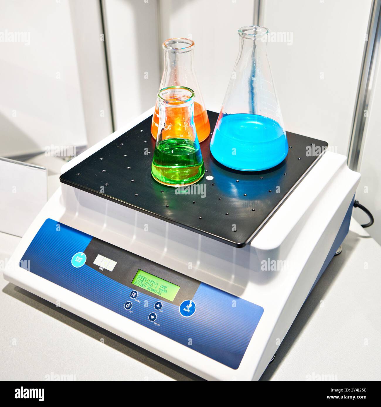 Laboratory shaker and flasks with solution Stock Photo - Alamy