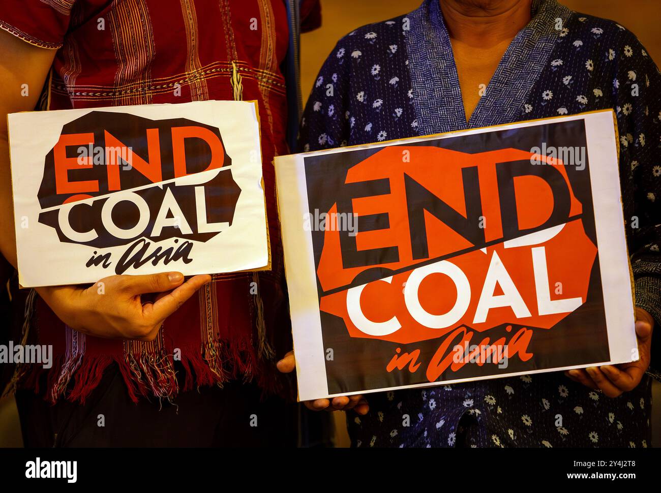 Participants hold placards during the event 'Love Northern Thailand, No ...