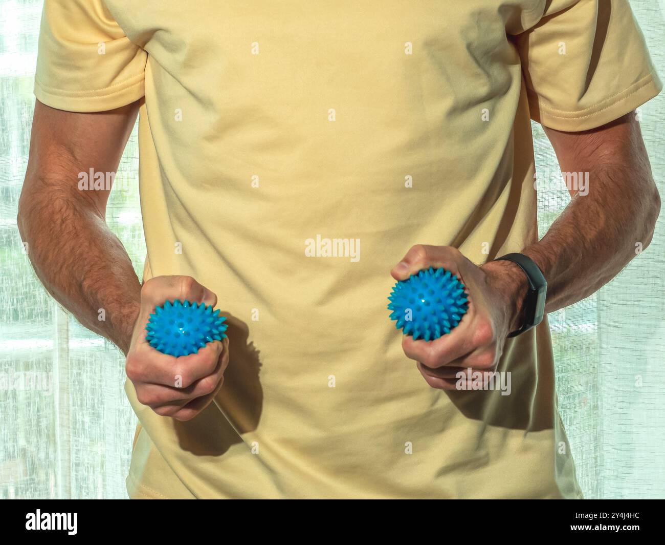 blue ball for hand rehabilitation with spikes, squeezing improves the ...