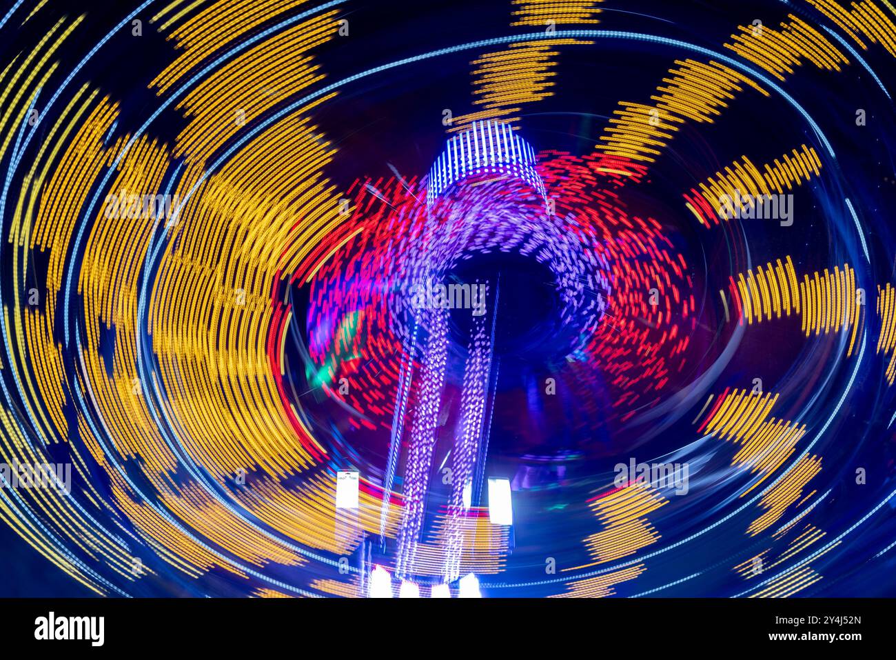 Light traces from the 'Equinox' fairground ride at the annual 'Witney ...