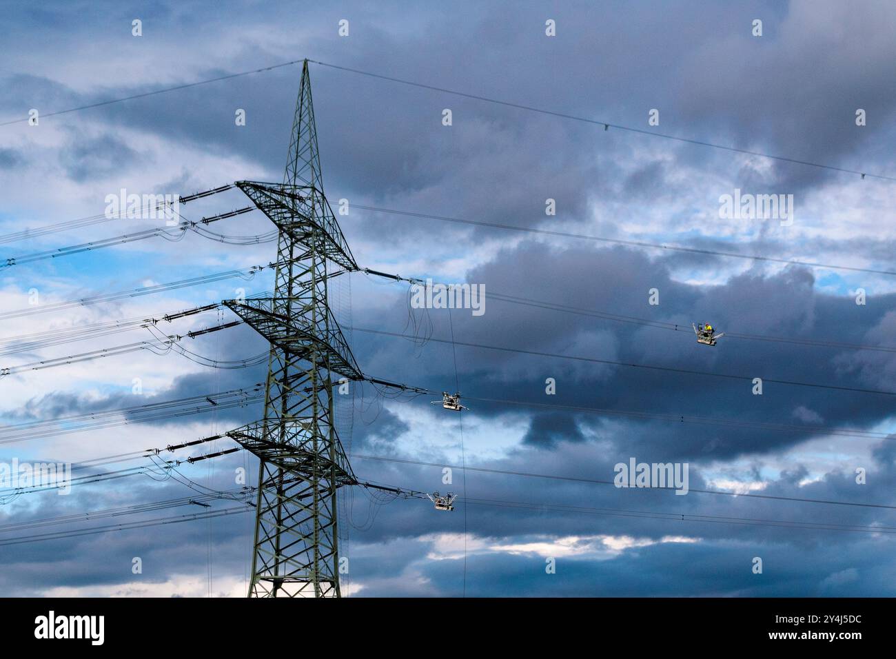 Building high-voltage lines Stock Photo - Alamy