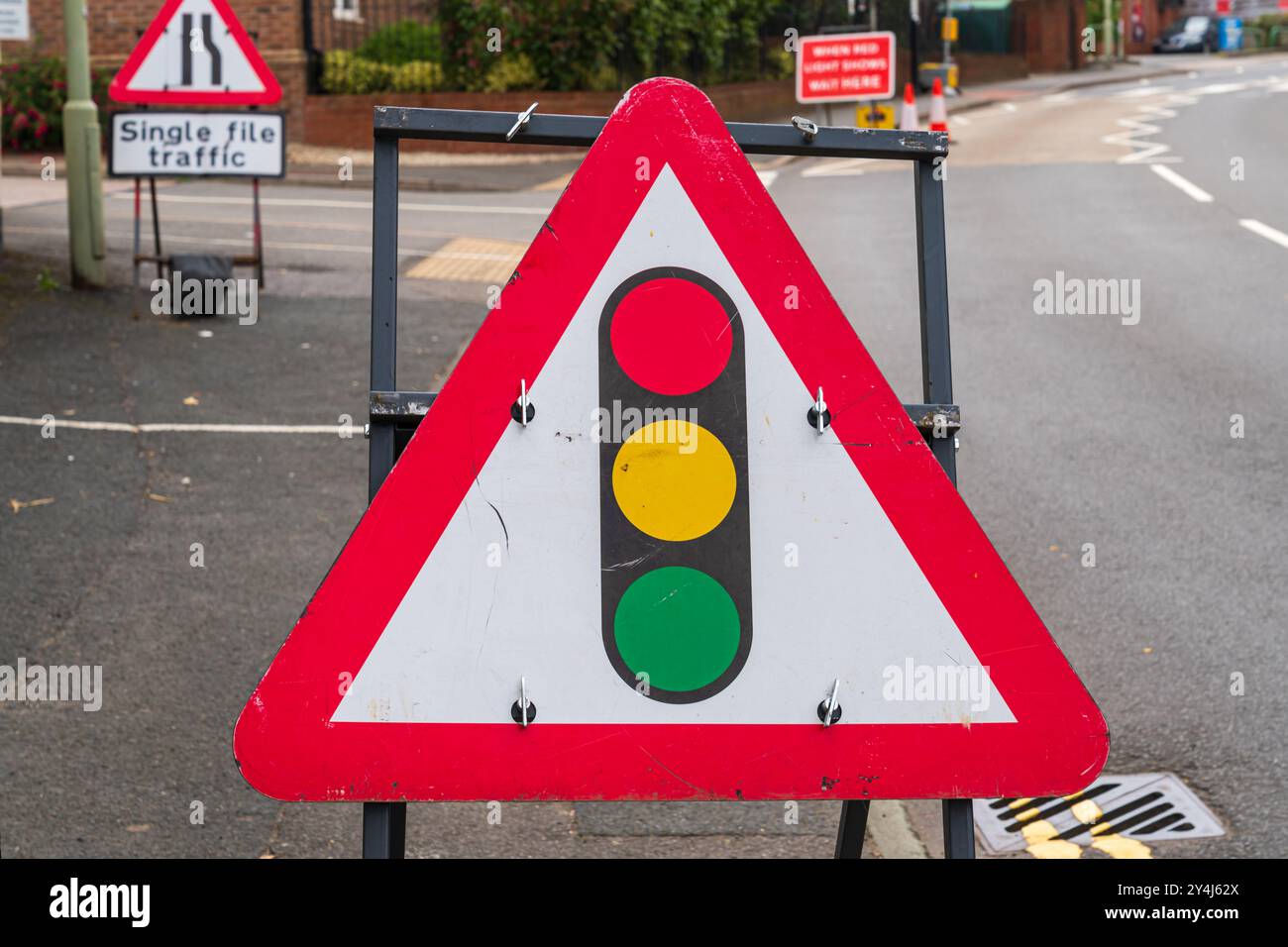 UK Traffic sign stating Traffic Lights ahead on a red and white warning ...