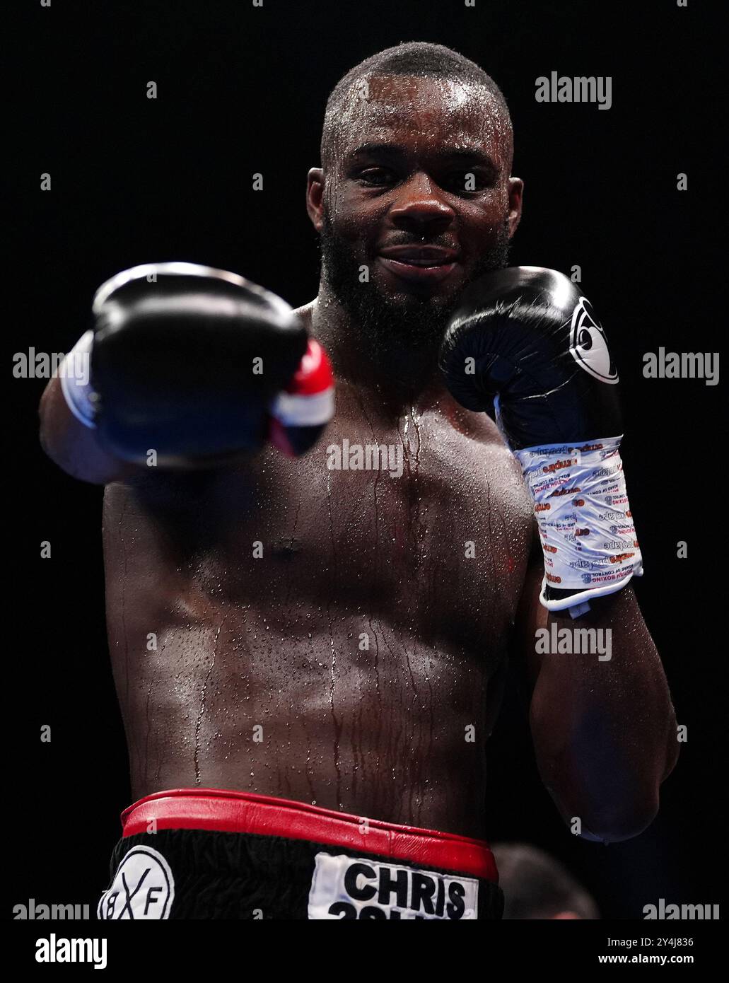 Chris Kongo (centre) celebrates after victory over Jacob Quinn in the ...