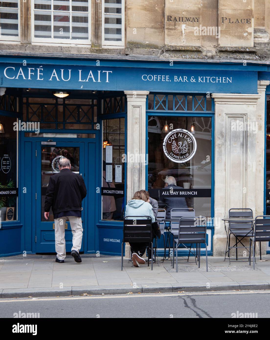 Charming view of a traditional cafe with blue exterior, offering a cozy ...