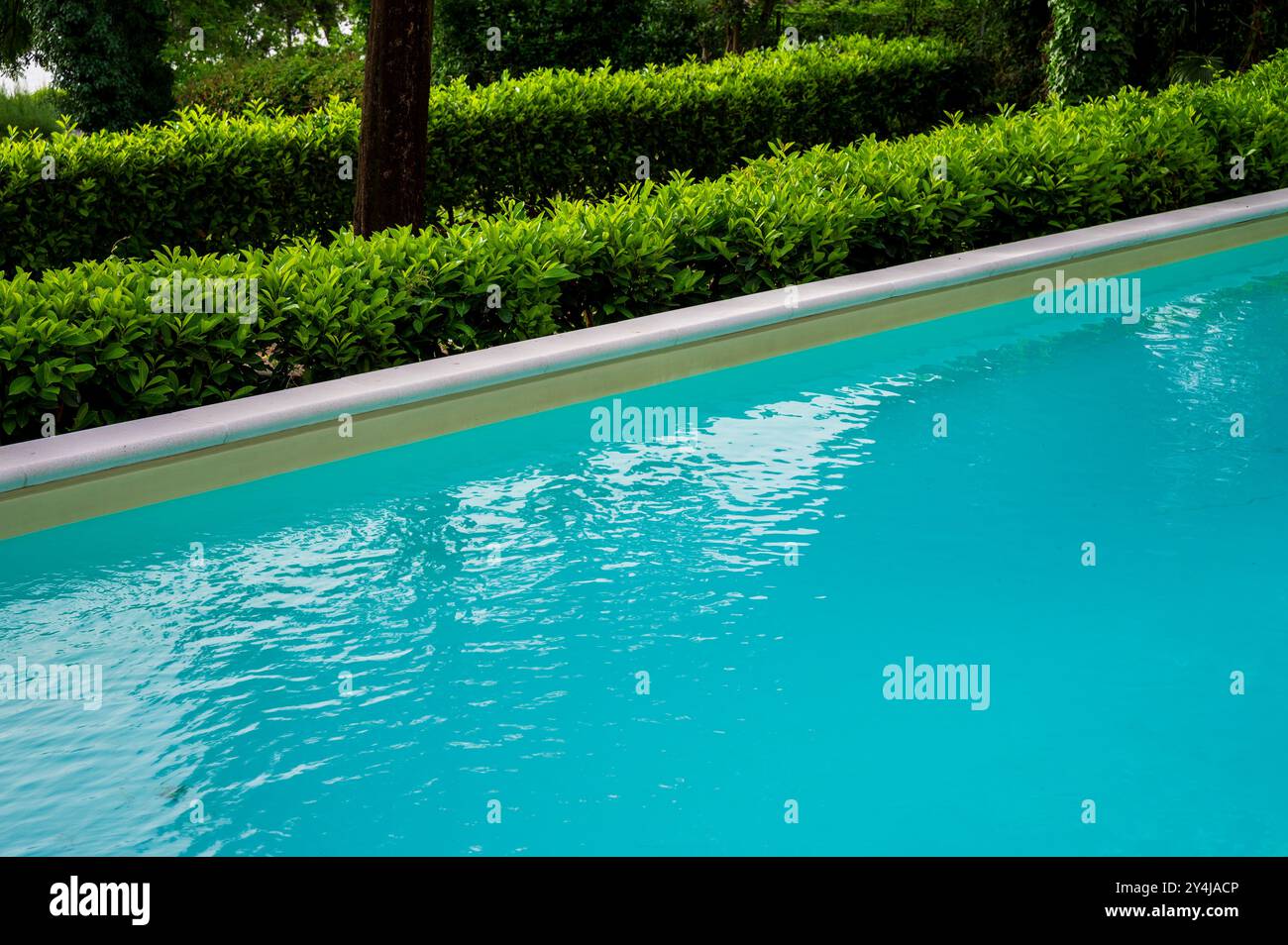 Swimming pool details and blue water. Swimming pool, ripple wave in ...