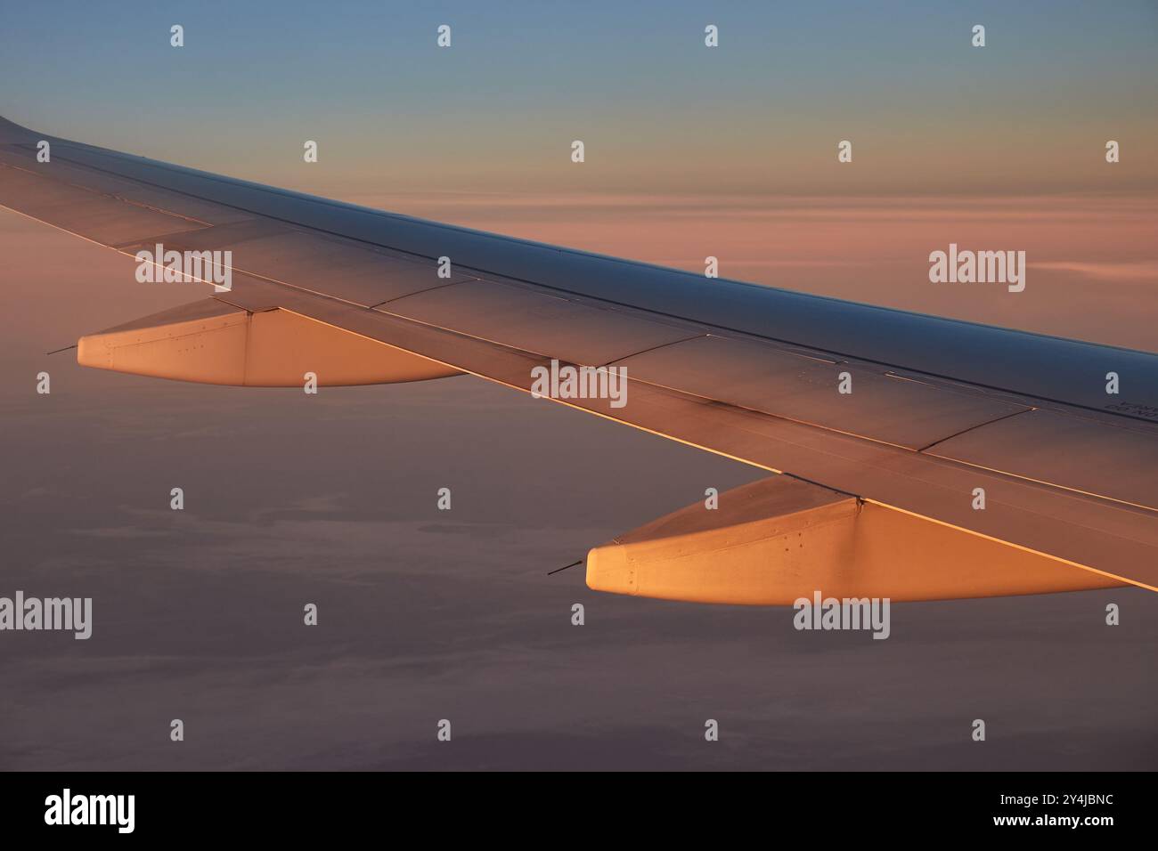 Airplane wing rising above clouds hi-res stock photography and images ...