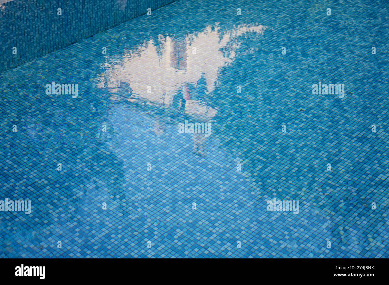 Swimming pool details and blue water. Swimming pool, ripple wave in ...
