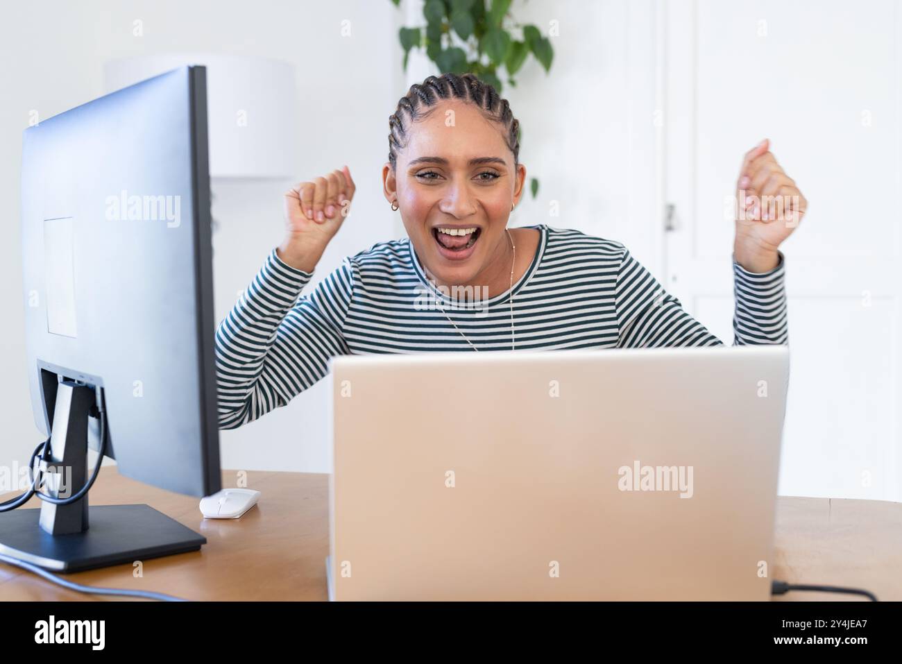 Excited woman computer home hi-res stock photography and images - Alamy