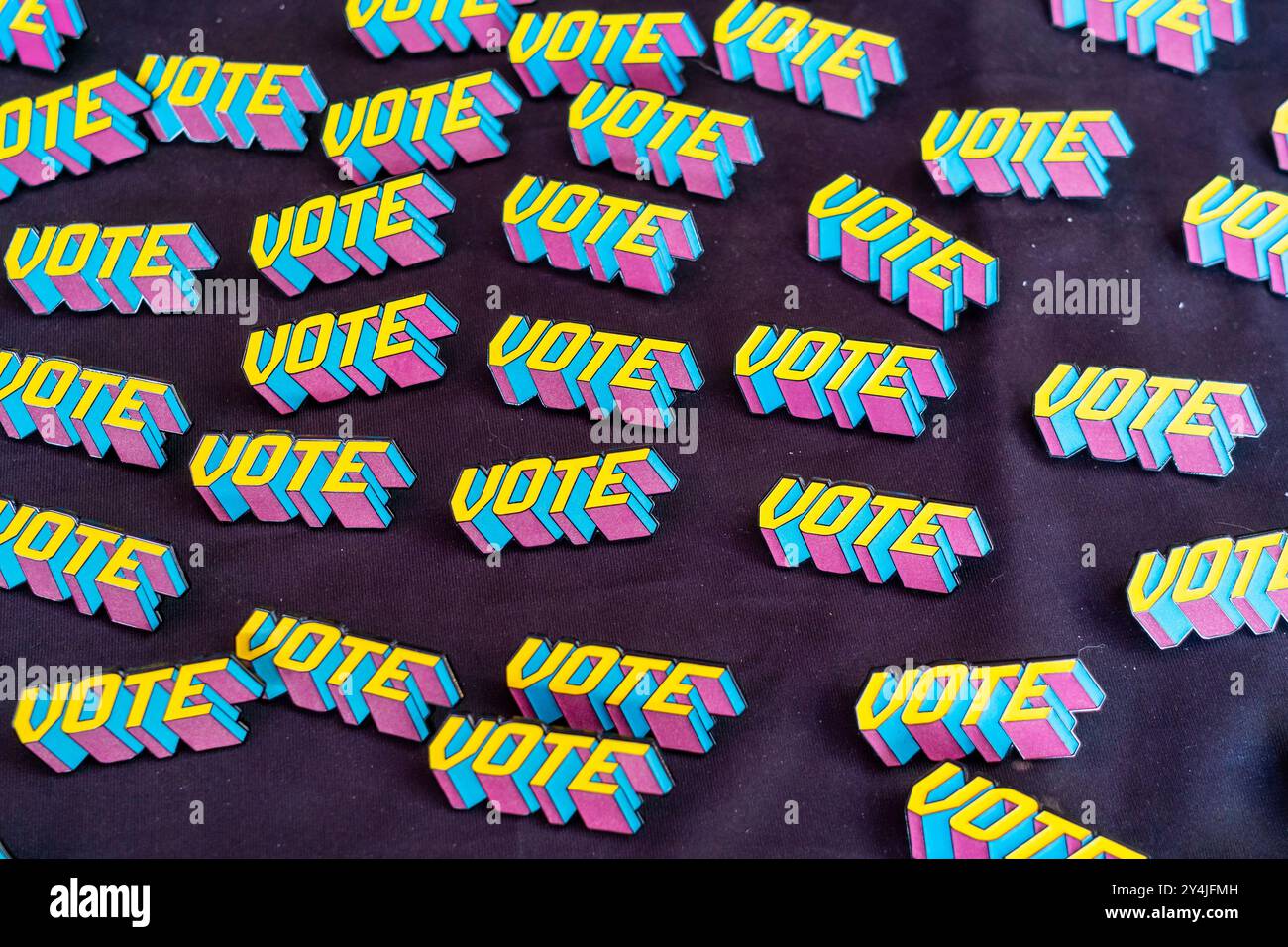 Voter registration pins at a table run by the Headcount organization at ...