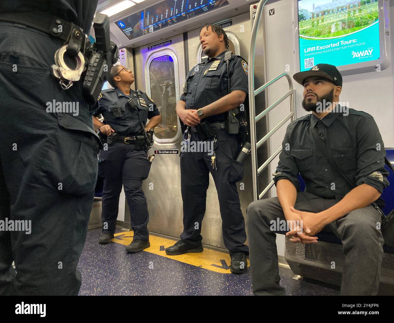 NYPD officers on an A train in New York on Wednesday, September 11 ...