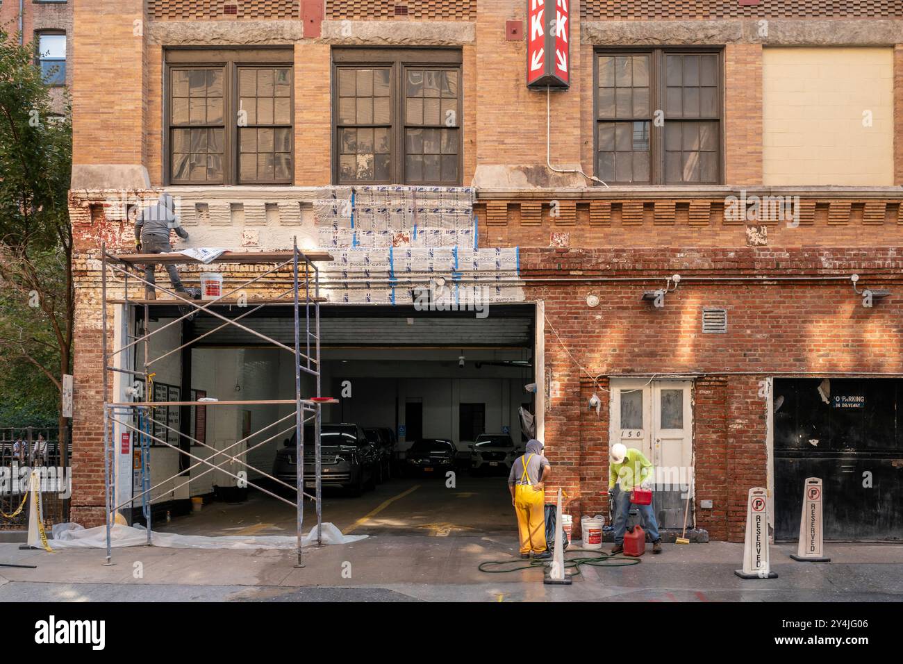 Repair work on a parking garage in the Chelsea neighborhood of New York ...