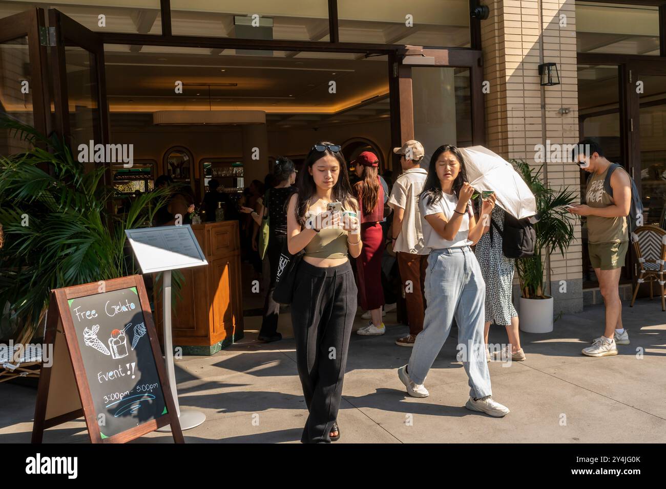 Gelato lovers line up outside of the opening of Realmuto Alta ...