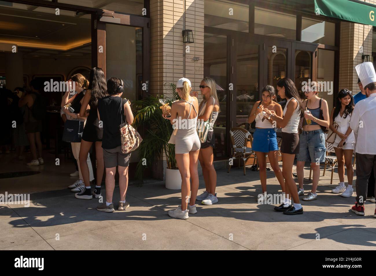Gelato lovers line up outside of the opening of Realmuto Alta ...