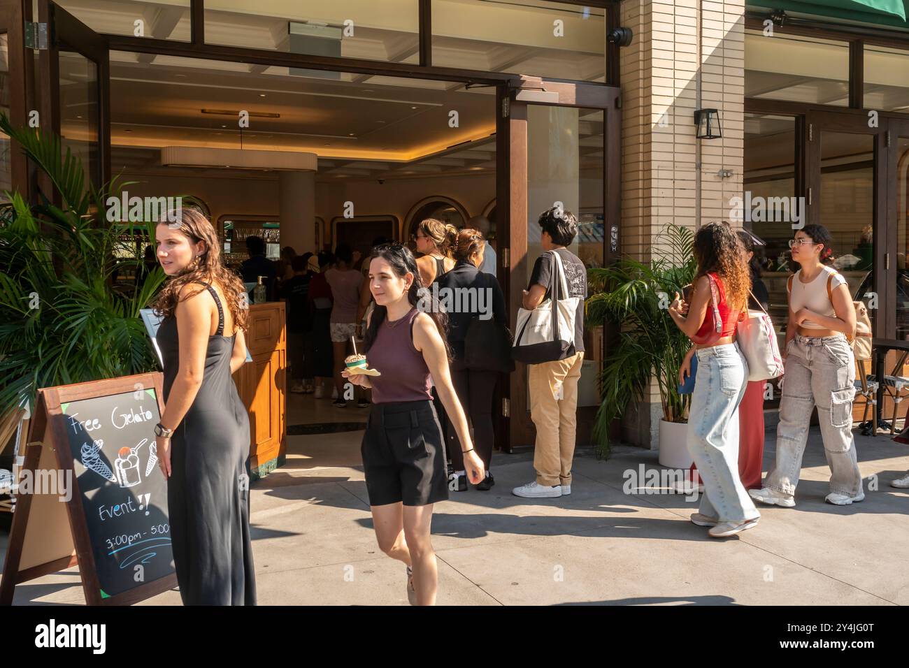 Gelato lovers line up outside of the opening of Realmuto Alta ...