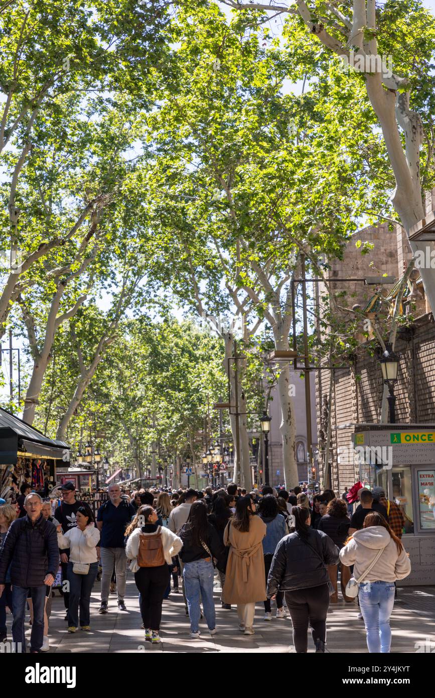 People stroll along La Rambla, one of Barcelona, Spain's most famous ...