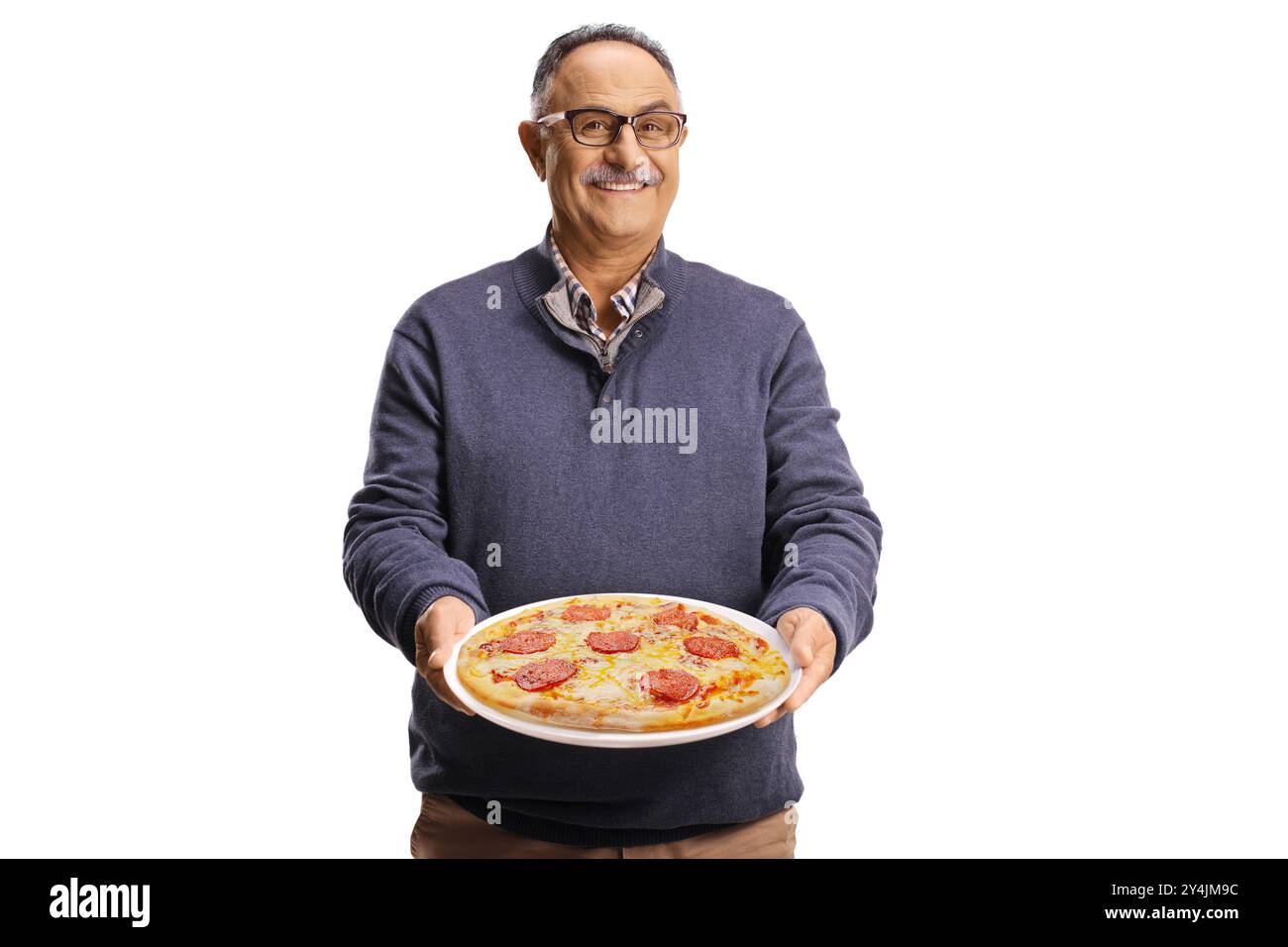 Mature man holding a pepperoni pizza on a plate isolated on white ...