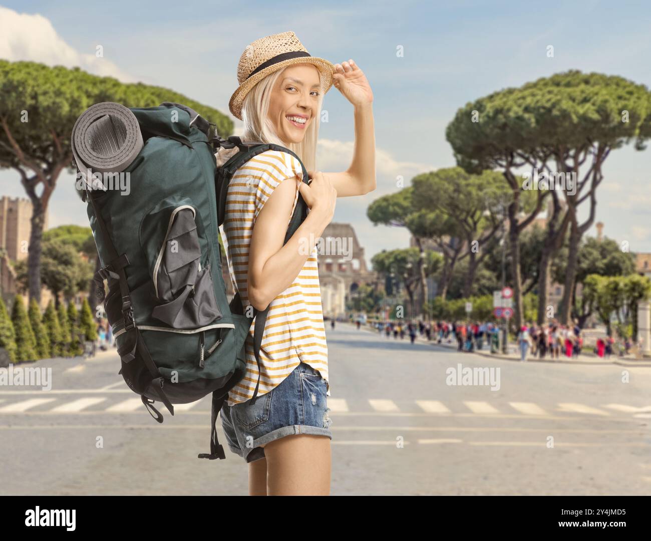 Female tourist in Rome carrying a backpack and greeting with hat Stock ...