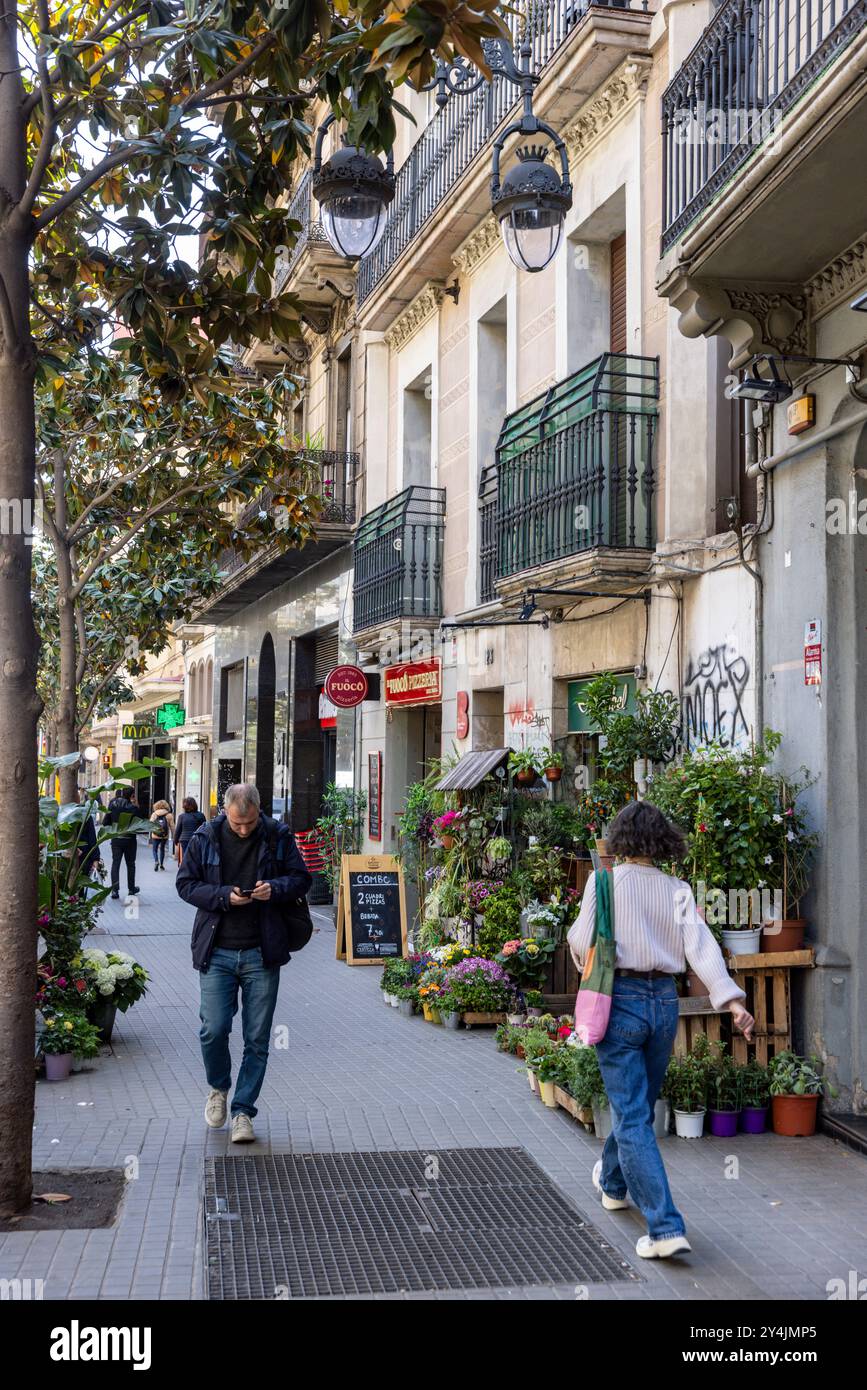 People shop and stroll through the Gracia district in Barcelona, Spain ...