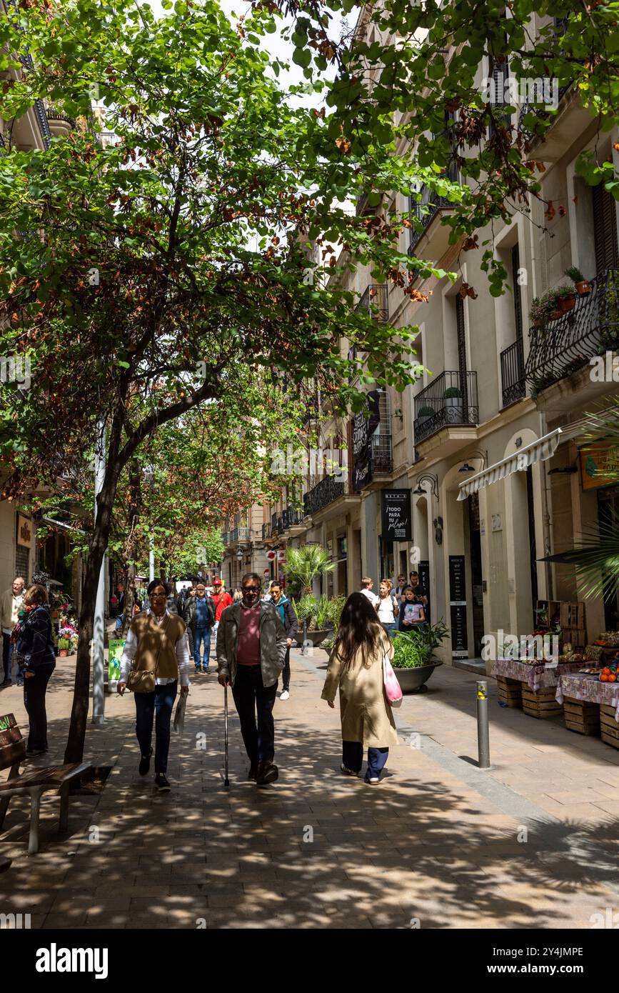 People shop and stroll through the Gracia district in Barcelona, Spain ...