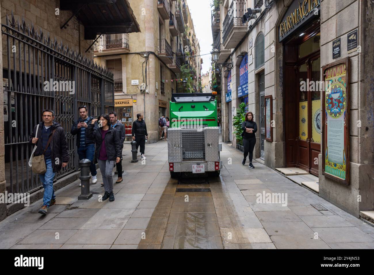 A small street cleaning vehicle cleans the narrow streets in La Ribera ...