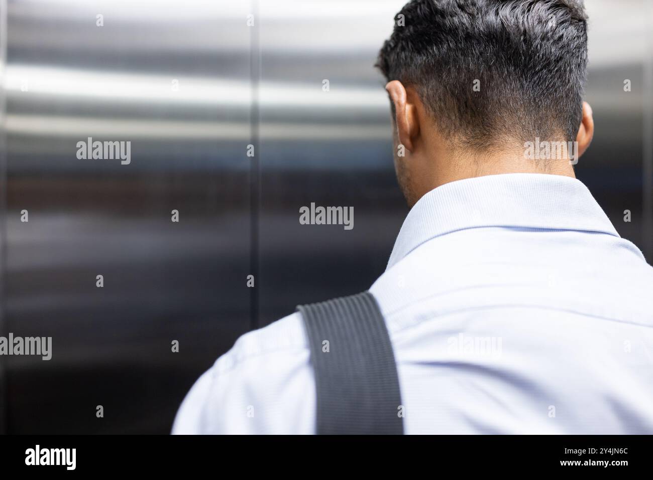 Businessman in elevator facing hi-res stock photography and images - Alamy