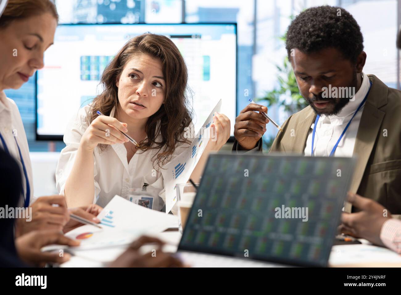 Business colleagues at a multinational company collaborating in ...