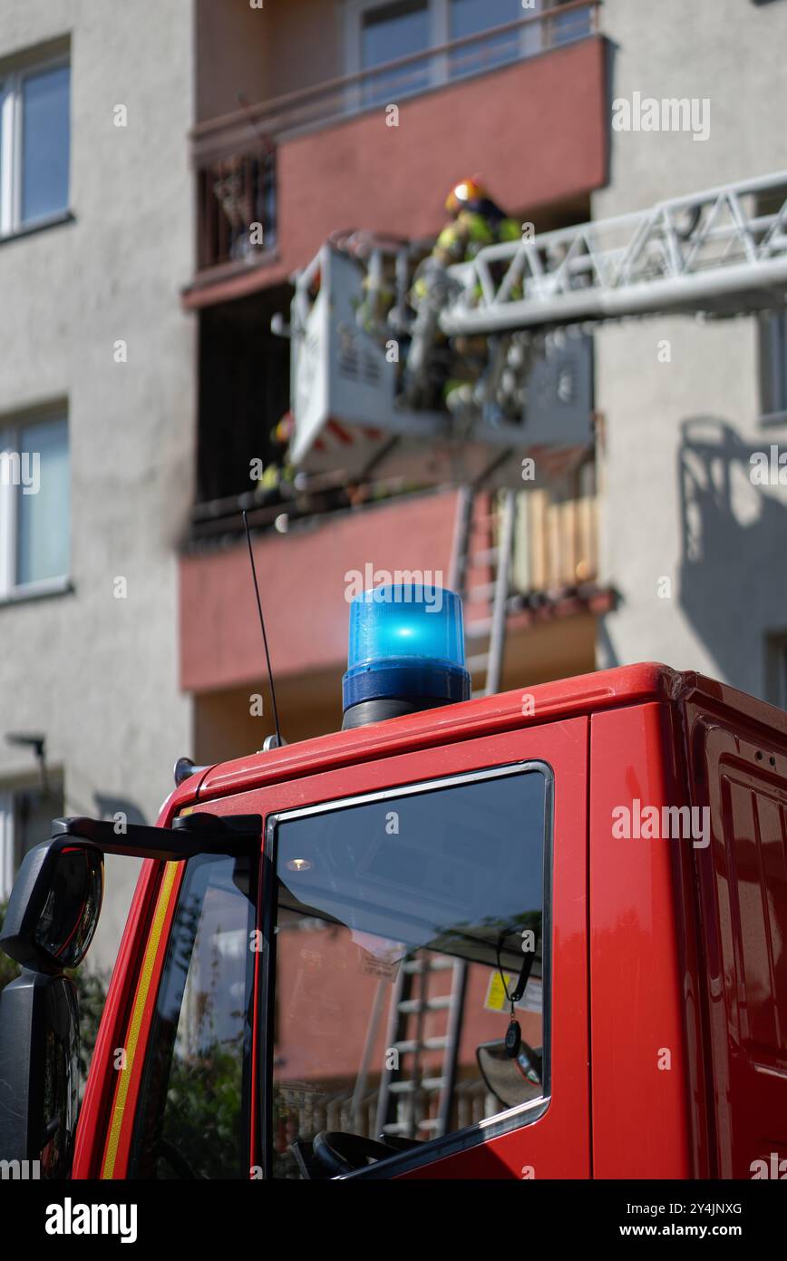 fire truck with extended elevated ladder reaches up to residential ...
