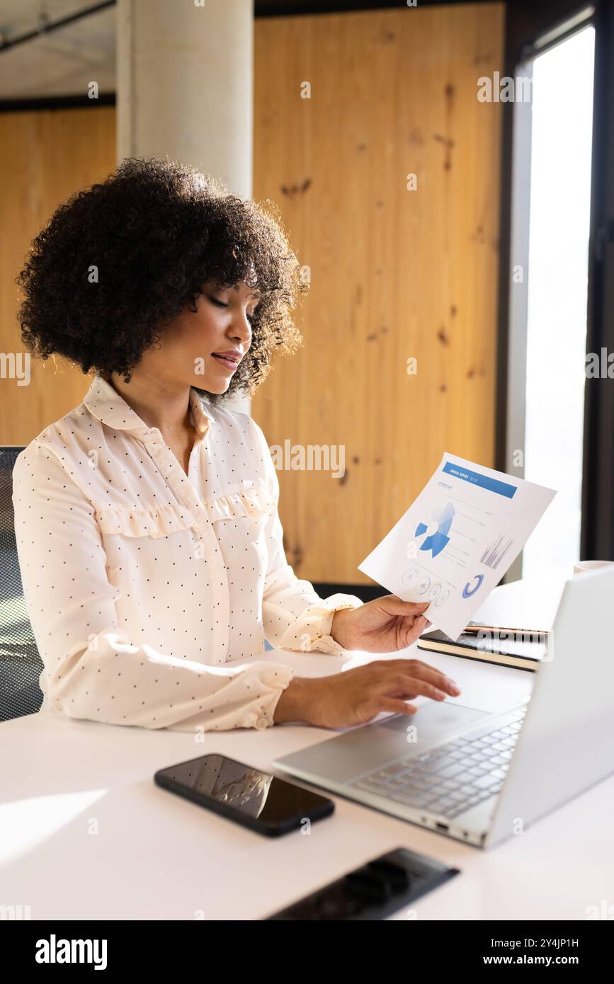 Woman in office analyzing document hi-res stock photography and images ...