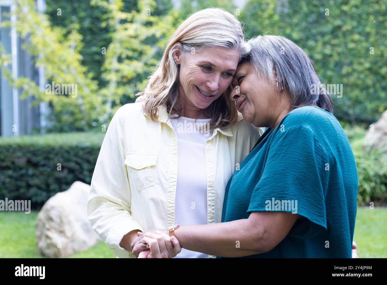 Friends smiling hugging in circle hi-res stock photography and images ...