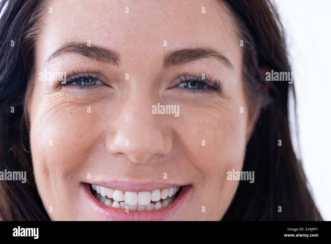 At home, Smiling woman showing happiness and joy, close-up of face with ...