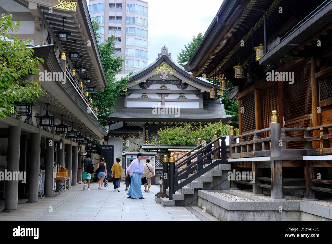 Visitors in the historic Yushima Tenmangu Shrine devoted to Tenjin the ...