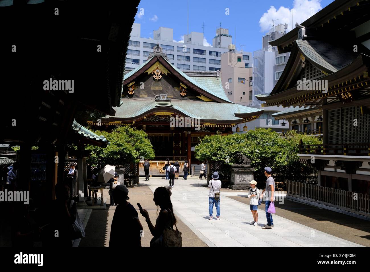 Visitors in the historic Yushima Tenmangu Shrine devoted to Tenjin the ...