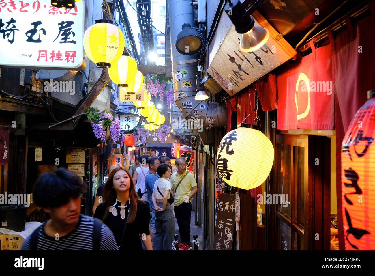 Omoidde Yokocho a nerrow alleyway lined up with Izakaya bars and ...