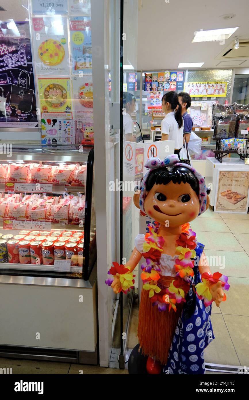 Fujiya's mascot Peko Chan by the Fujiya confectionery store entrance in ...