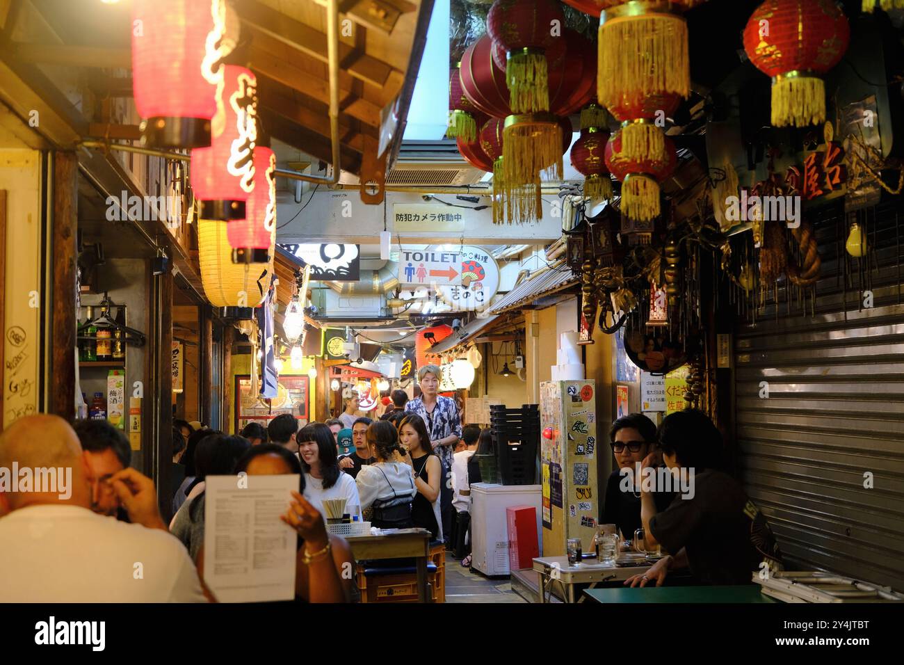 The interior view of Ebisu Yokocho, a narrow alleyway contains food ...