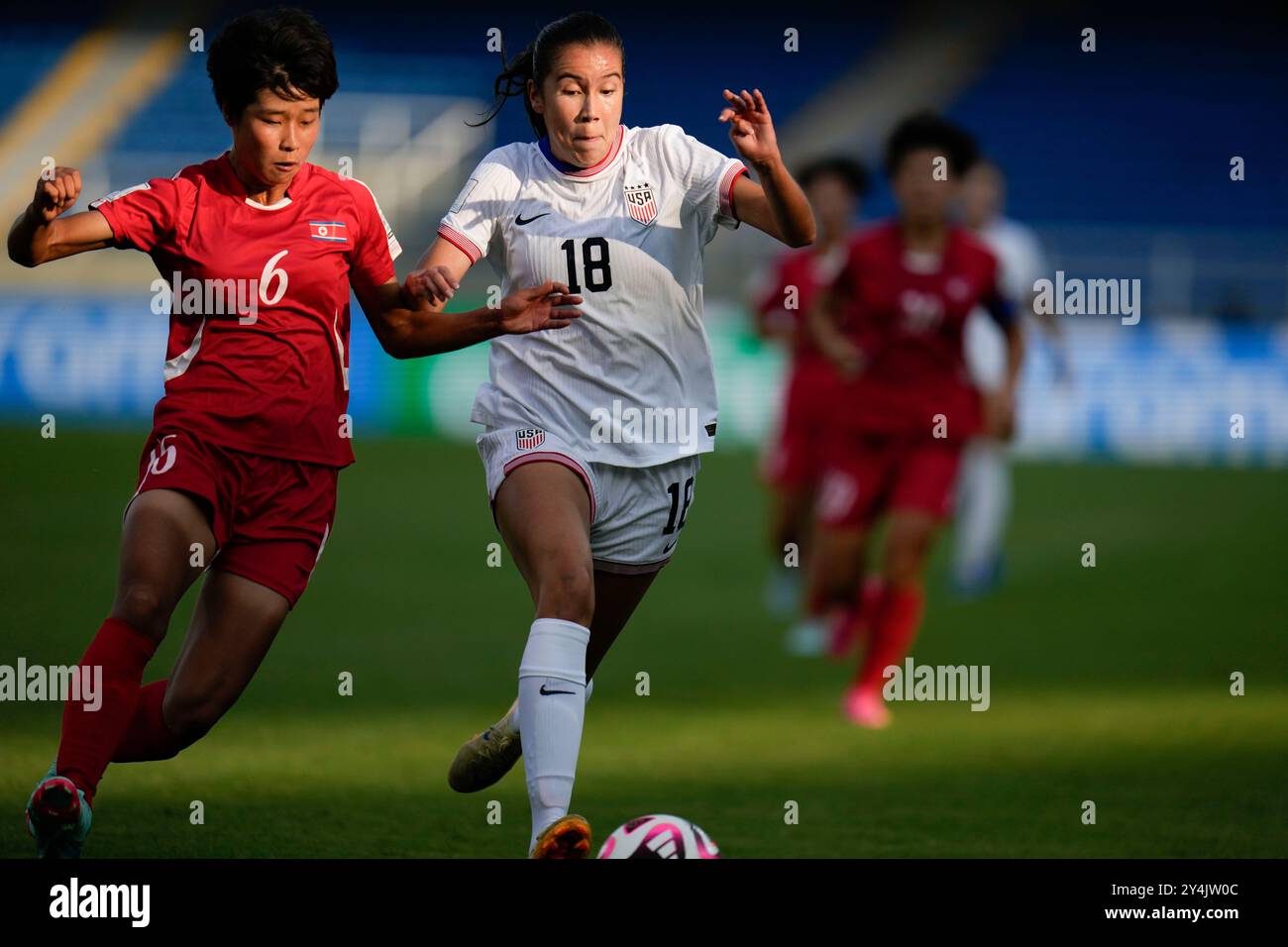 North Korea's Kim Kang Mi, left, and the United States' Yuna McCormack ...