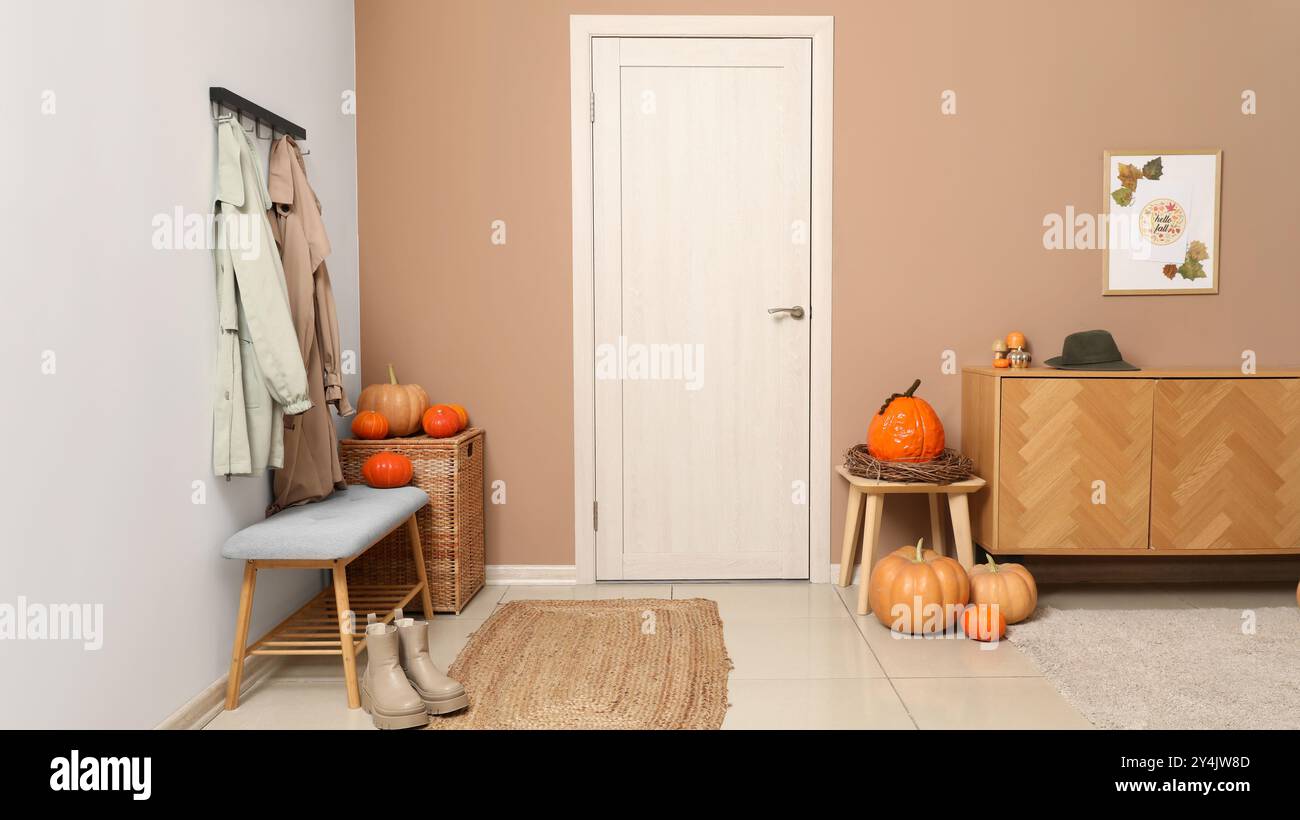 Interior of hallway with autumn decor, commode and soft bench Stock ...