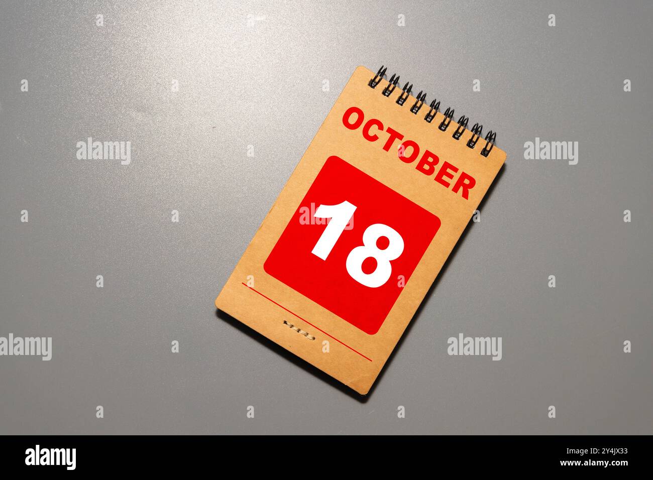 Wooden calendar with the date October 18 on desktop with laptop Stock ...