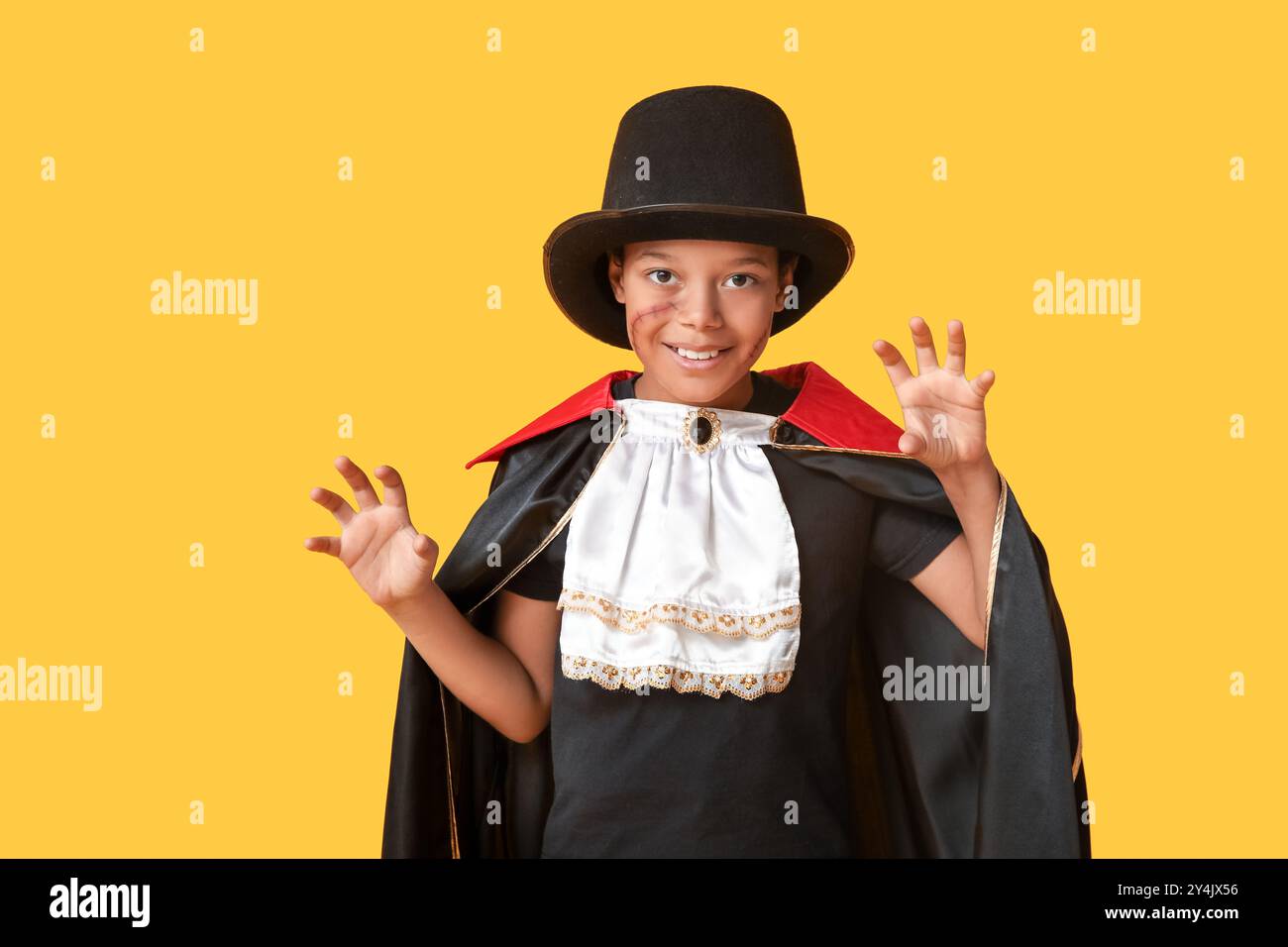 Cute happy African-American boy dressed as Dracula for Halloween party ...