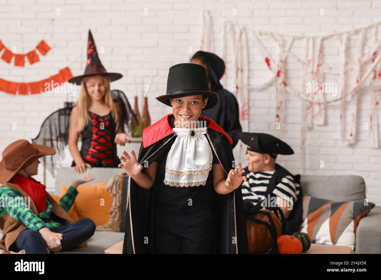 Cute happy African-American boy dressed as Dracula for Halloween party ...