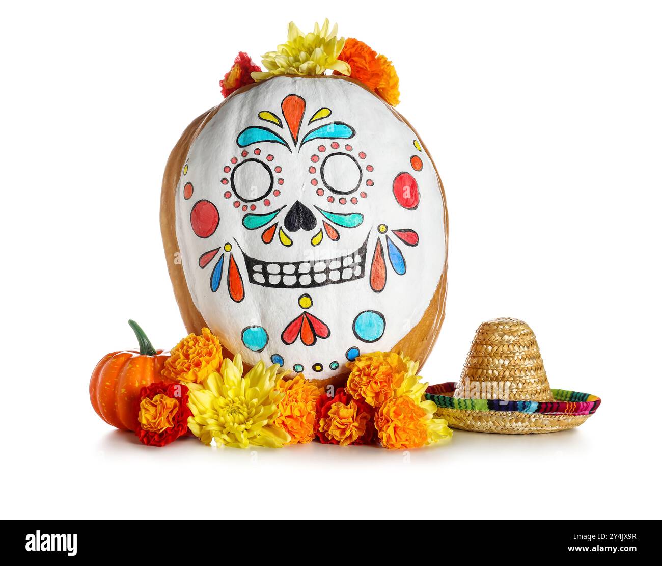 Pumpkin with painted skull, mini sombrero and flowers on white ...