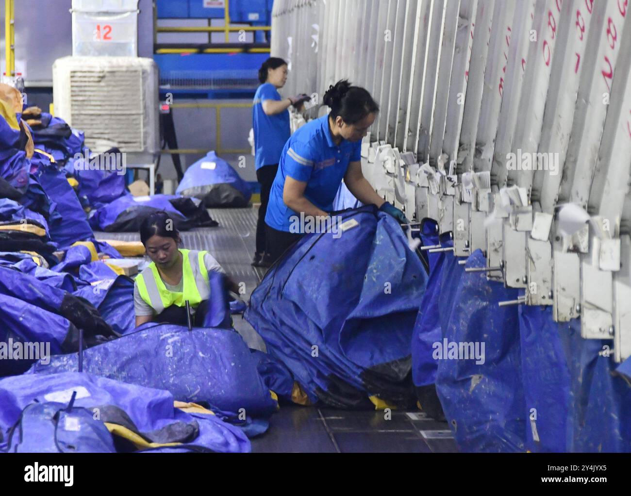 HANDAN, CHINA - SEPTEMBER 15, 2024 - Workers sort deliveries at the ZTO ...