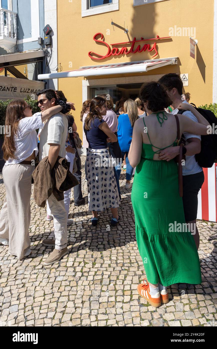 Visitors to the popular ice cream shop Santini line up in Cascais ...