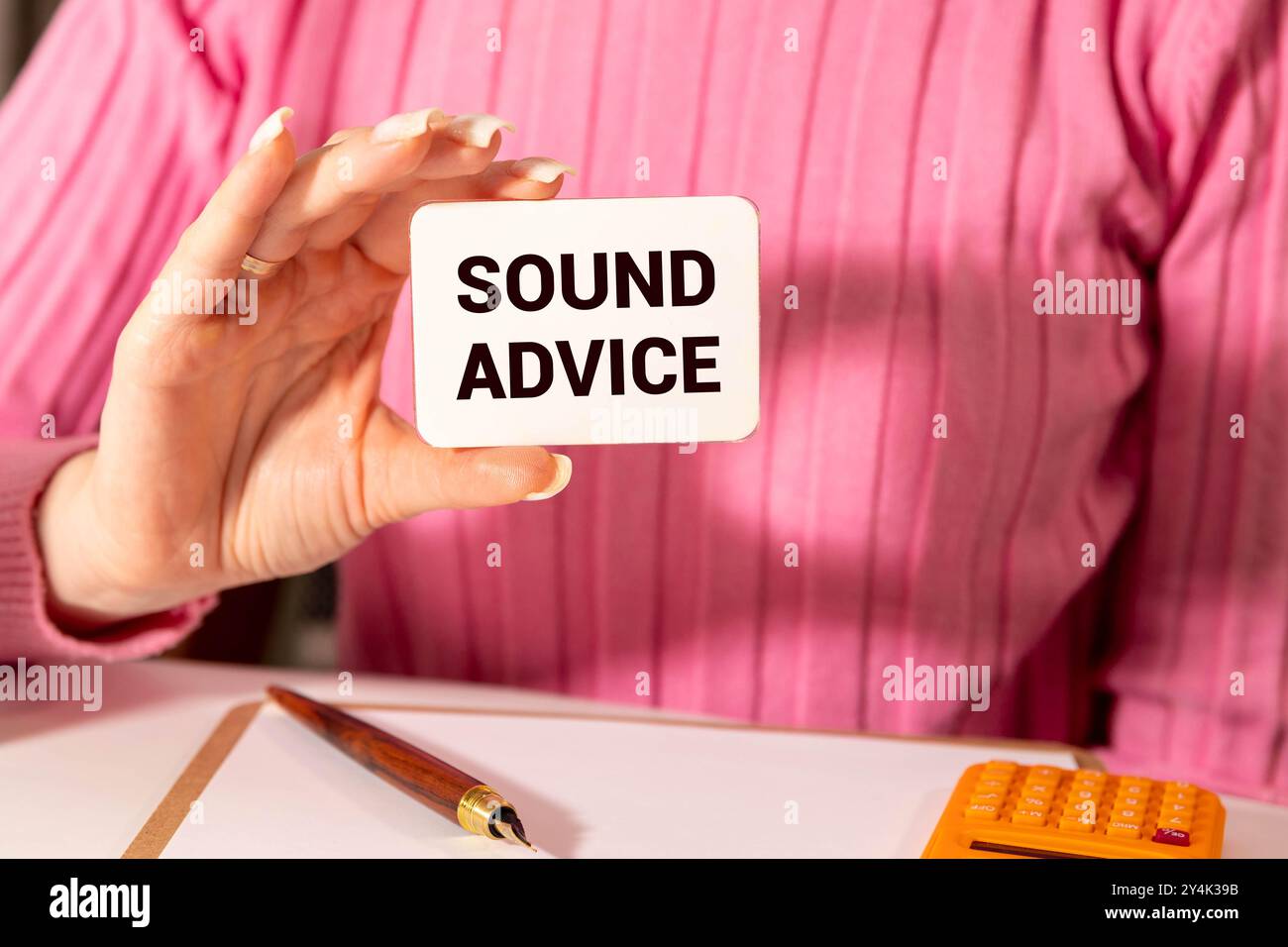 Business concept.Text SOUND ADVICE with calculator and banknote on ...